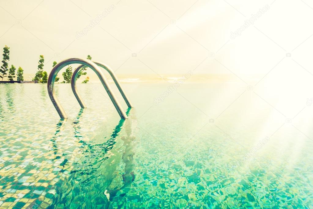 Beautiful luxury Swimming pool resort Stock Photo by ©mrsiraphol 97440232