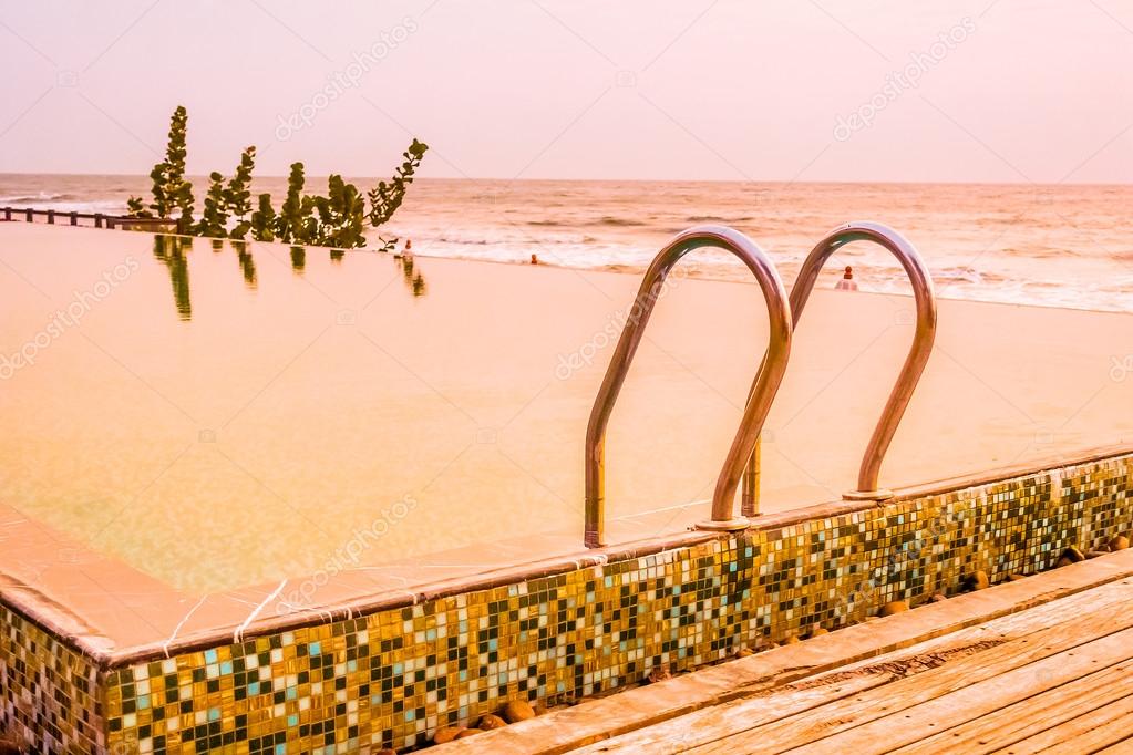 Beautiful luxury Swimming pool resort Stock Photo by ©mrsiraphol 97545054