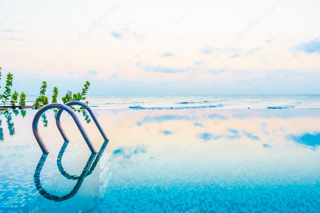 Beautiful luxury Swimming pool resort Stock Photo by ©mrsiraphol 97650000