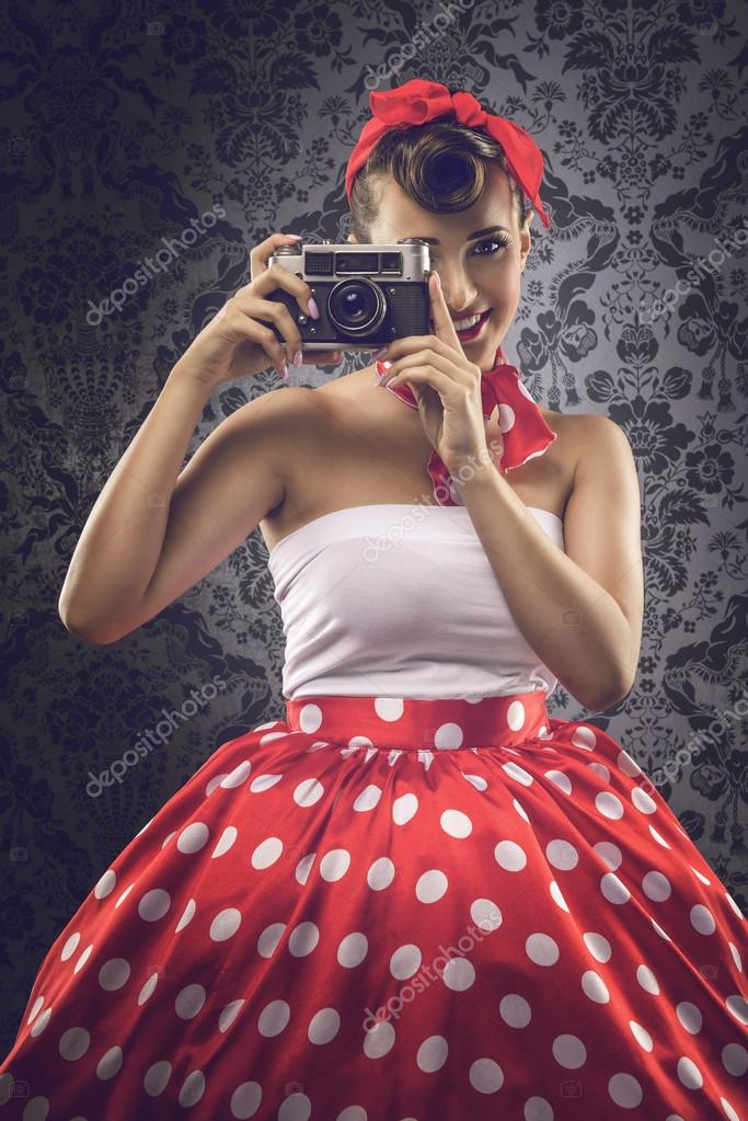 Woman using an old camera — Stock Photo © Geribody #73308251