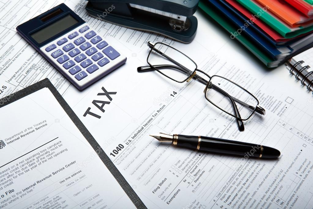 Filling tax return on desktop — Stock Photo © mizar_219842 #83157906