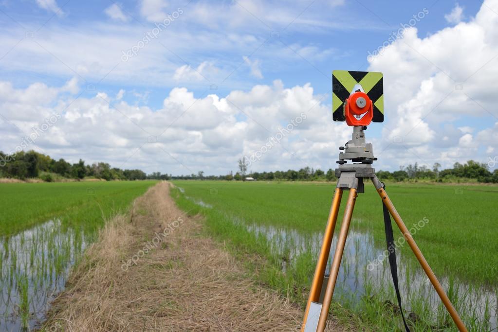 Survey instrument set on a tripod in the field Stock Photo by ©thavornc ...