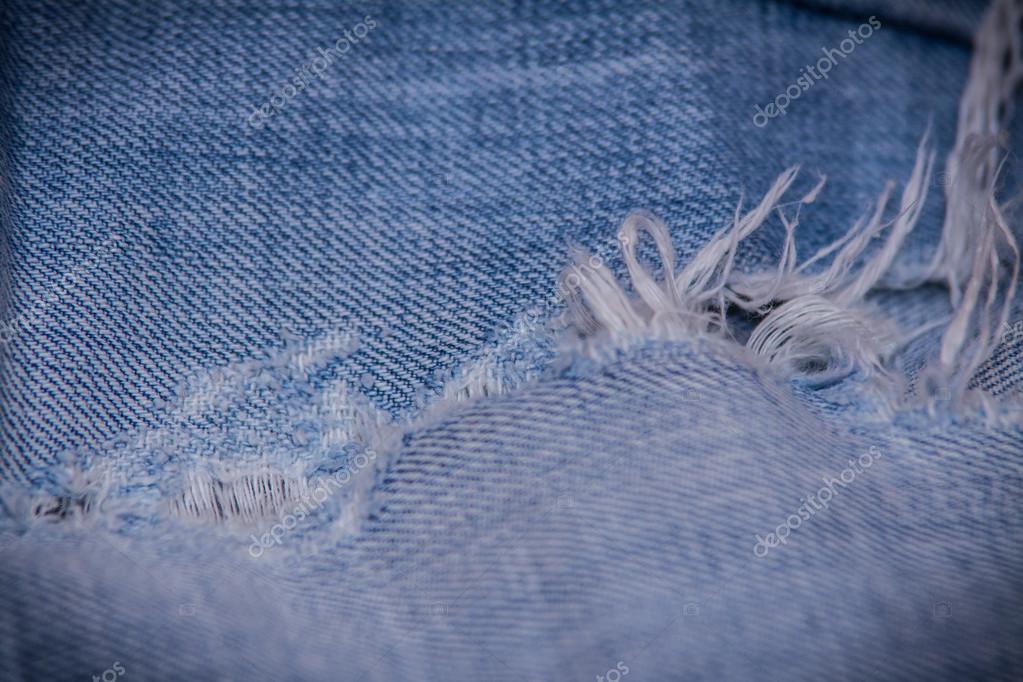 Ripped jeans — Stock Photo © cornflowerz #56072773