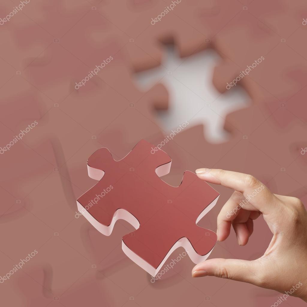 Female hand placing last piece of Puzzle as concept — Stock Photo ...
