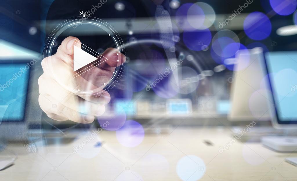 Hand press play button sign to start or initiate projects as con Stock ...