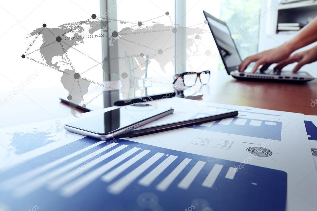 Business documents on office table with digital tablet and man w ...