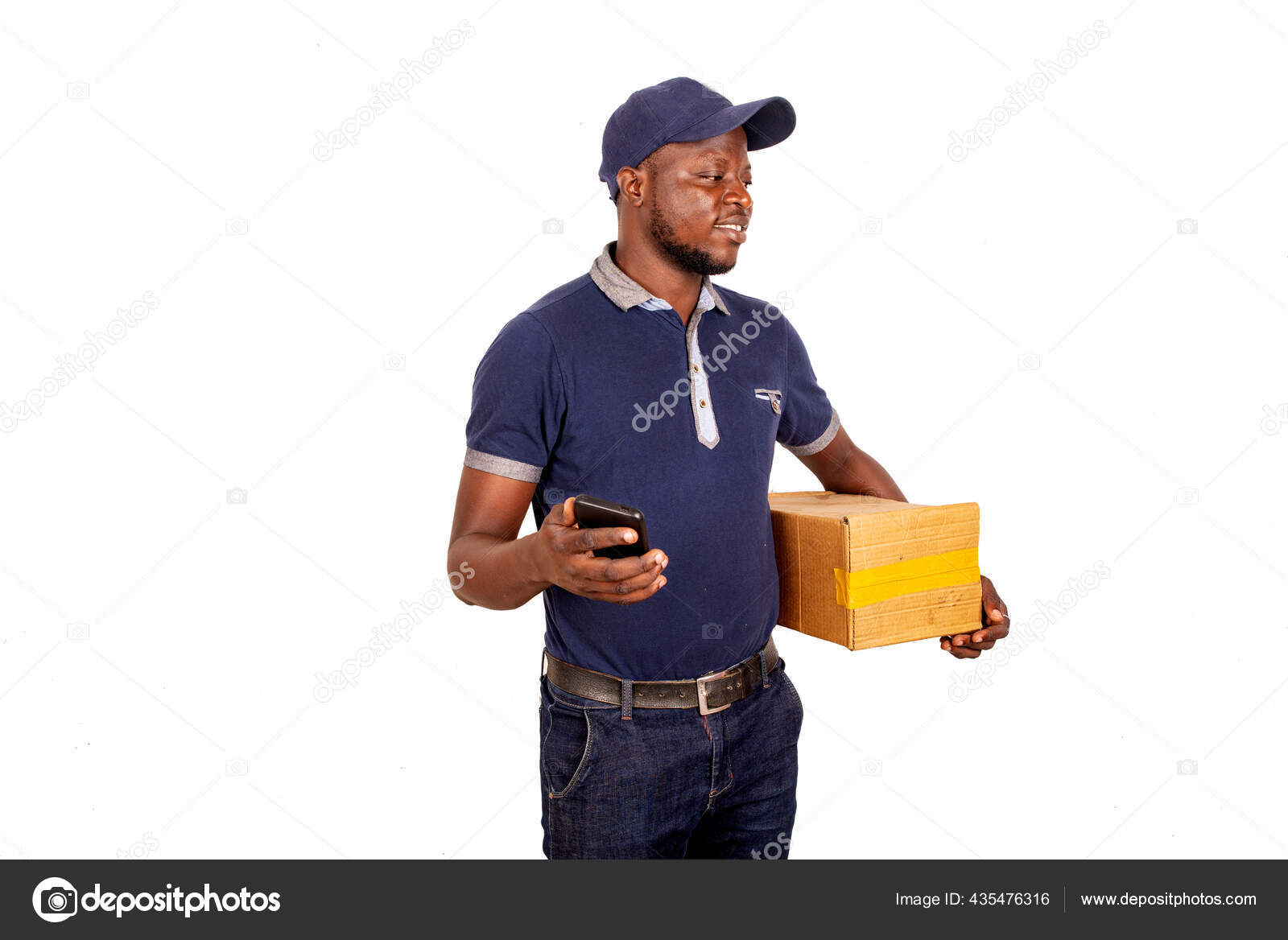 Handsome Delivery Man Standing Holding Cardboard Cellphone While Being ...