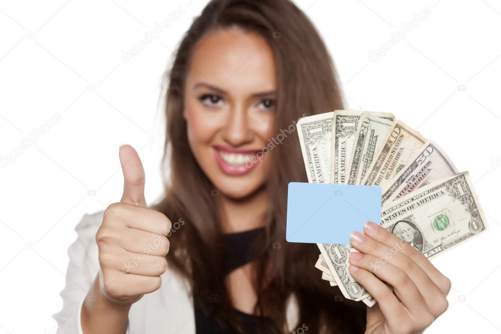 Woman holding credit card and cash — Stock Photo © VGeorgiev #93977658 Woman holding credit card and cash — Stock Photo © VGeorgiev #93977658