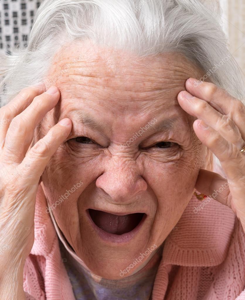 Closeup portrait of scared old woman Stock Photo by ©VBaleha 62153999