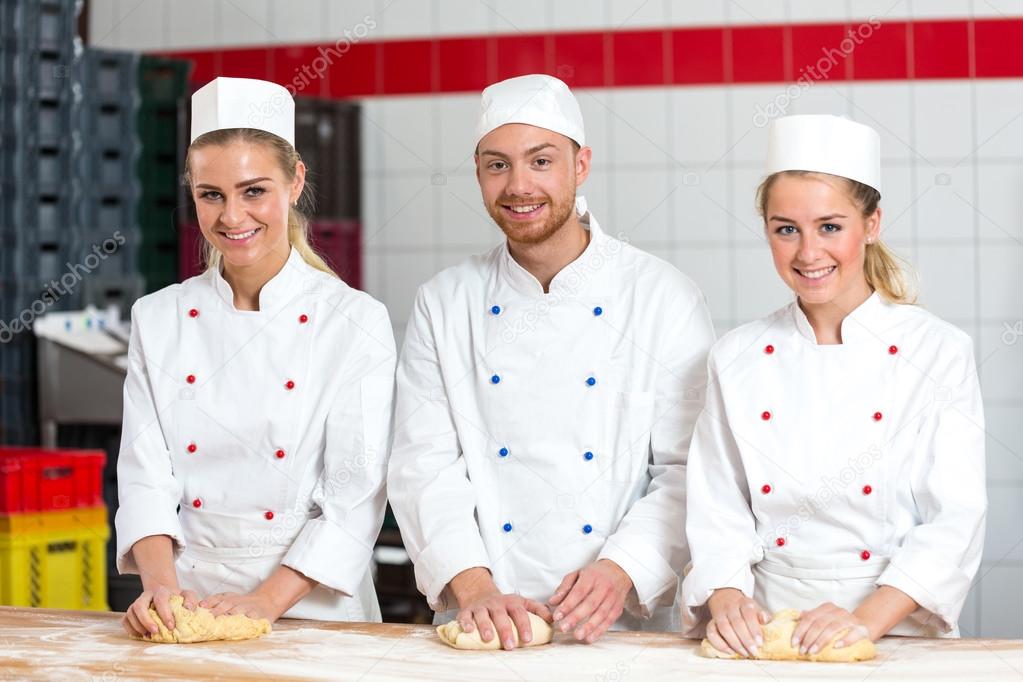 Three bakers in bakery kneading fresh dough Stock Photo by ©Ikonoklast ...
