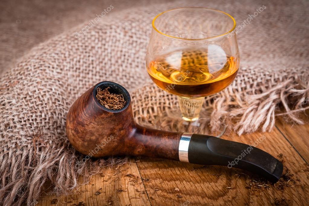 Overview of cognac and smoking pipe, men's set Stock Photo by ...