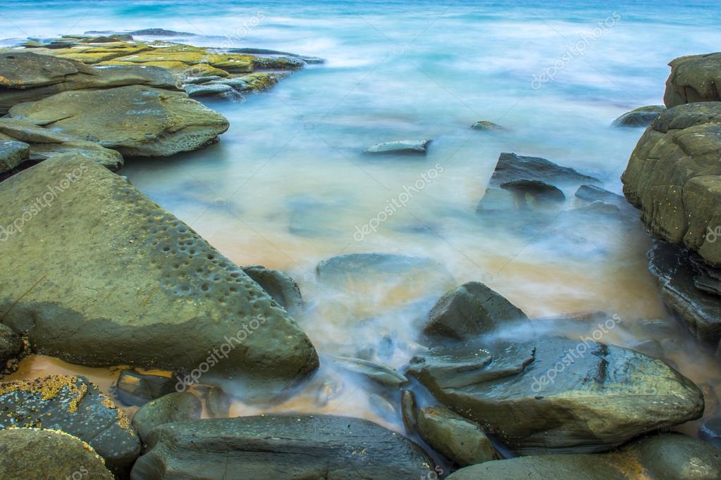 Rocks and waves at Point Cartwright — Stock Photo © artistrobd #93876366