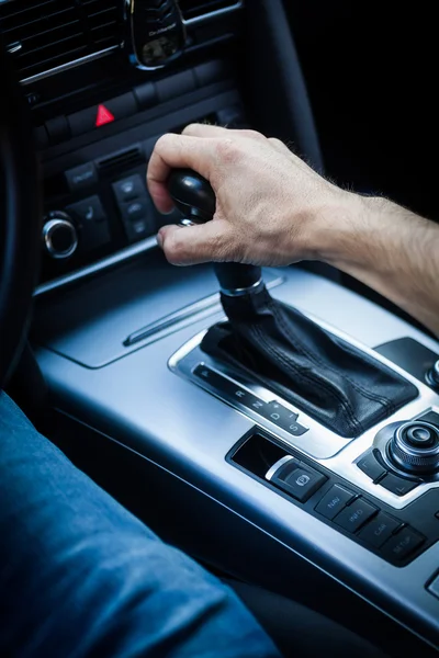 Hand on manual gear shift knob — Stock Photo © jjayo #10712179