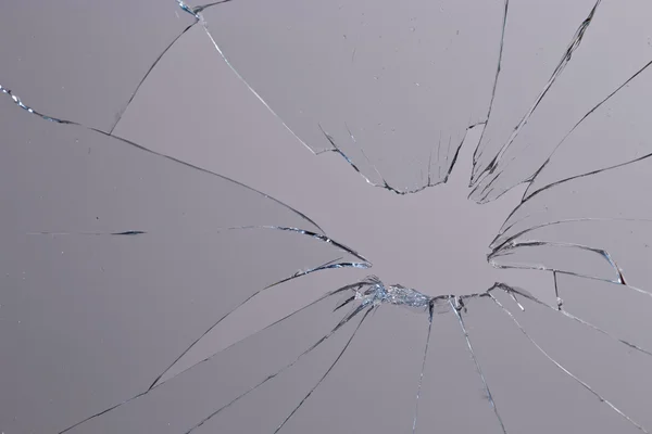Broken glass grey background Stock Photo by ©PatriciaCH 70376631