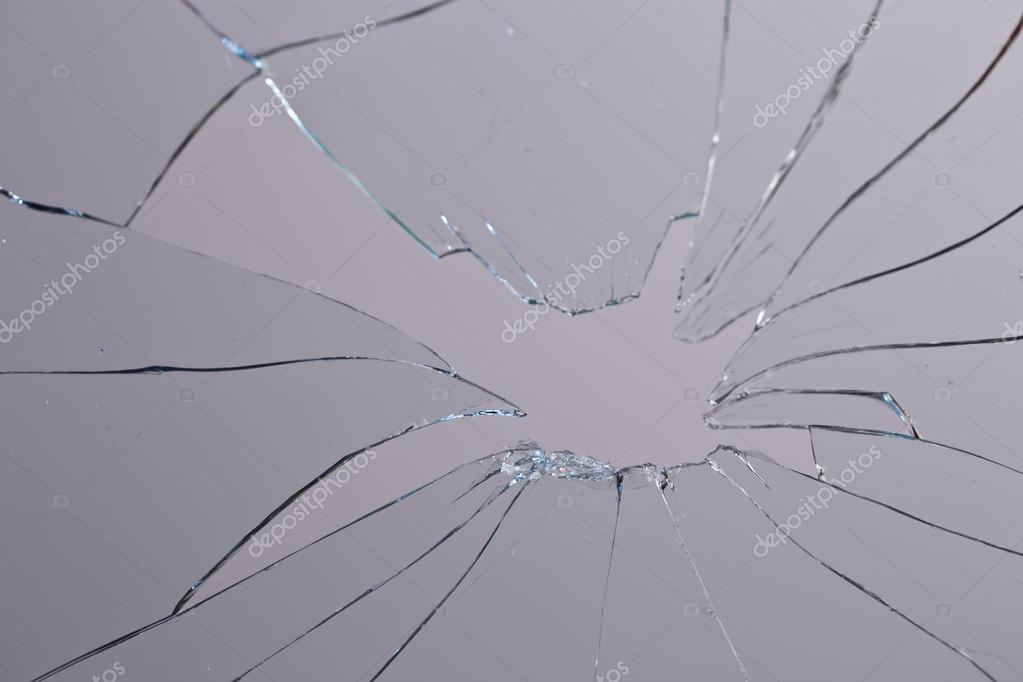 Broken glass grey background Stock Photo by ©PatriciaCH 70376631