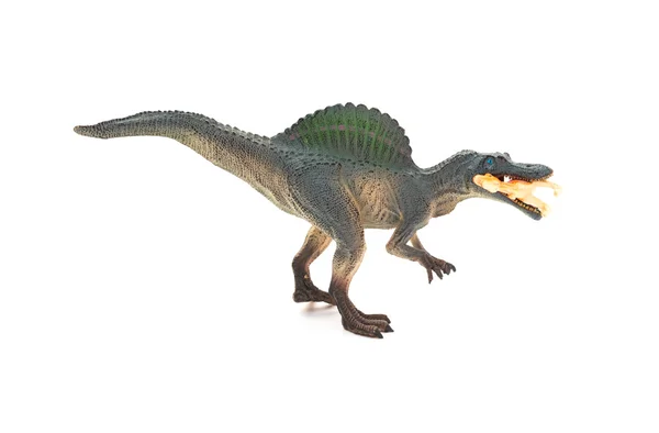 Side view grey spinosaurus toy on a white background Stock Photo by ...