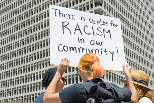 Woman raising a sign - Stock Image - Everypixel