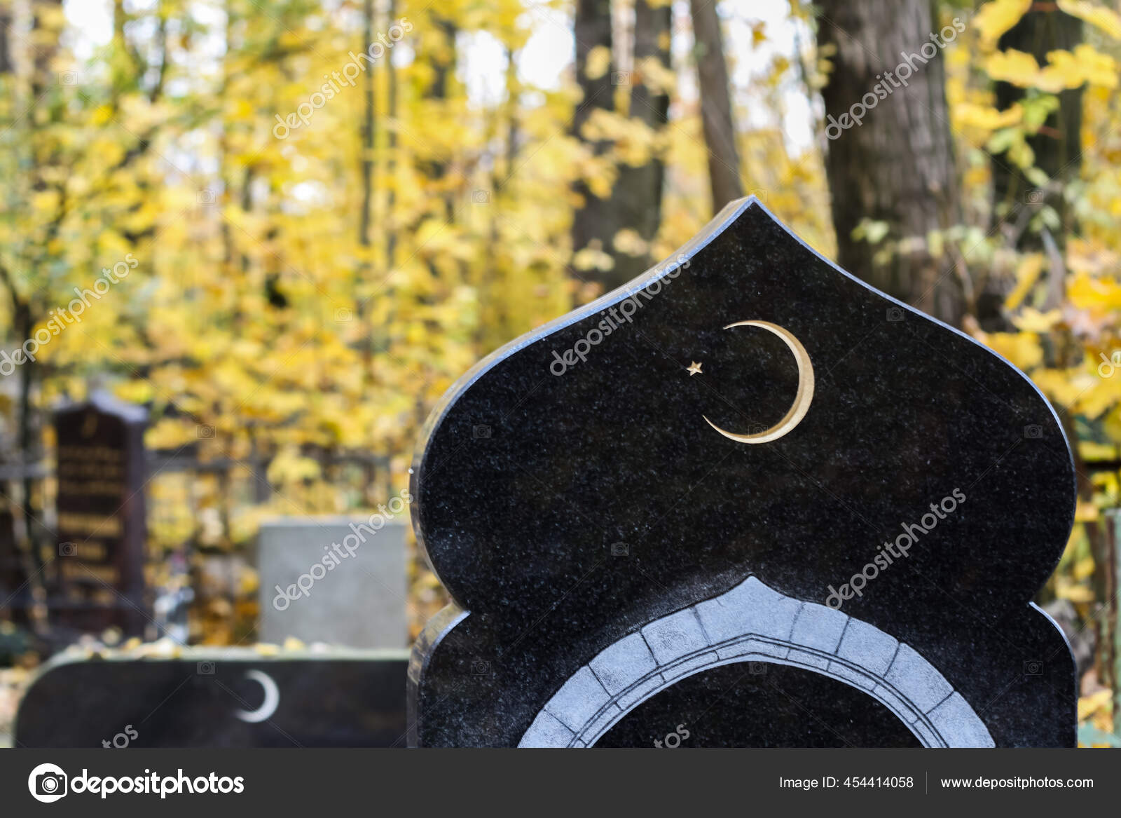 Muslim crescent moon with a star on a dark marble gravestone. Waxing ...