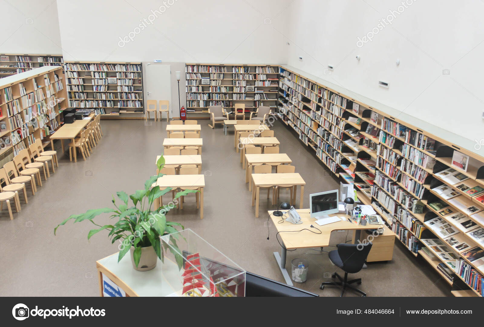 Scandinavian interior in library with wooden furniture and workspace ...