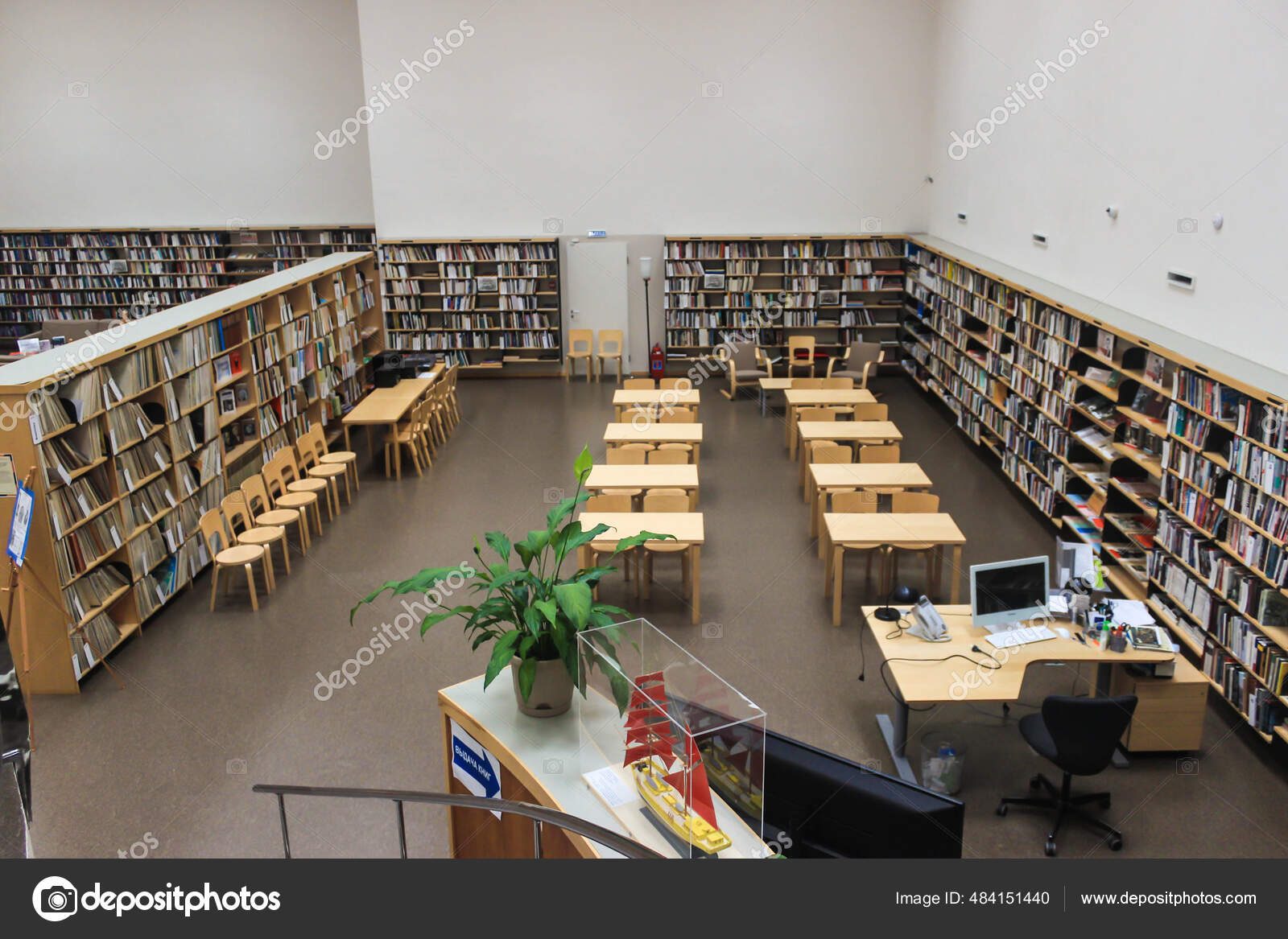 Scandinavian interior in library with wooden furniture and workspace ...