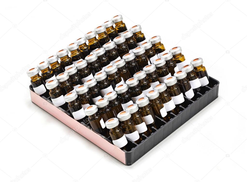 Vials in rack Stock Photo by ©smuayc 59183257