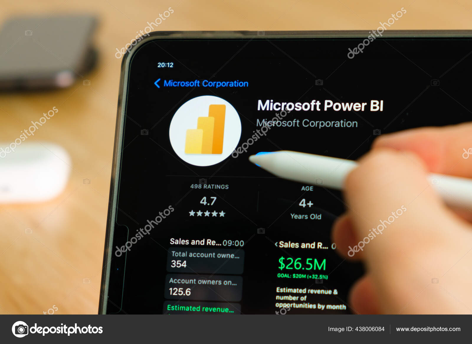 Microsoft Power BI logo shown by apple pencil on the iPad Pro tablet ...
