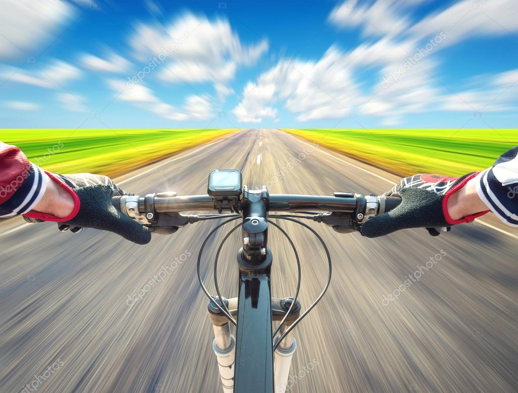 Ride on bycycle on road Stock Photo by ©biletskiy_e 124700320