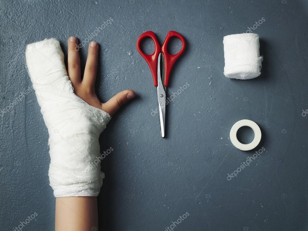 Still life.broken arm of child.first aid kit on stone floor Stock Photo ...