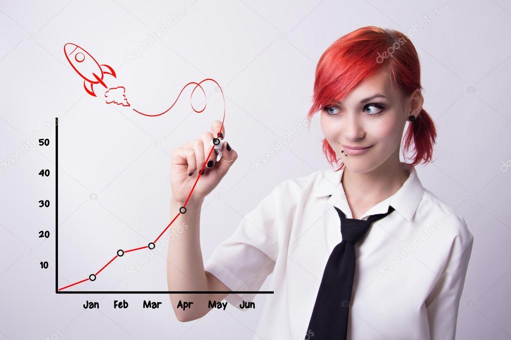 Red-haired girl draws a graph of the marker — Stock Photo © Veremeev ...