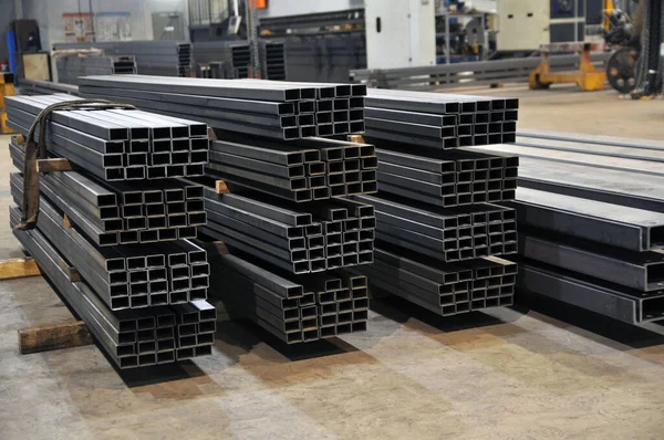 Profile pipe made of steel cut on a band saw in the workshop of the ...