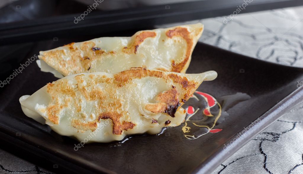 Japanese gyoza on a black plate — Stock Photo © venemama2 #56067247