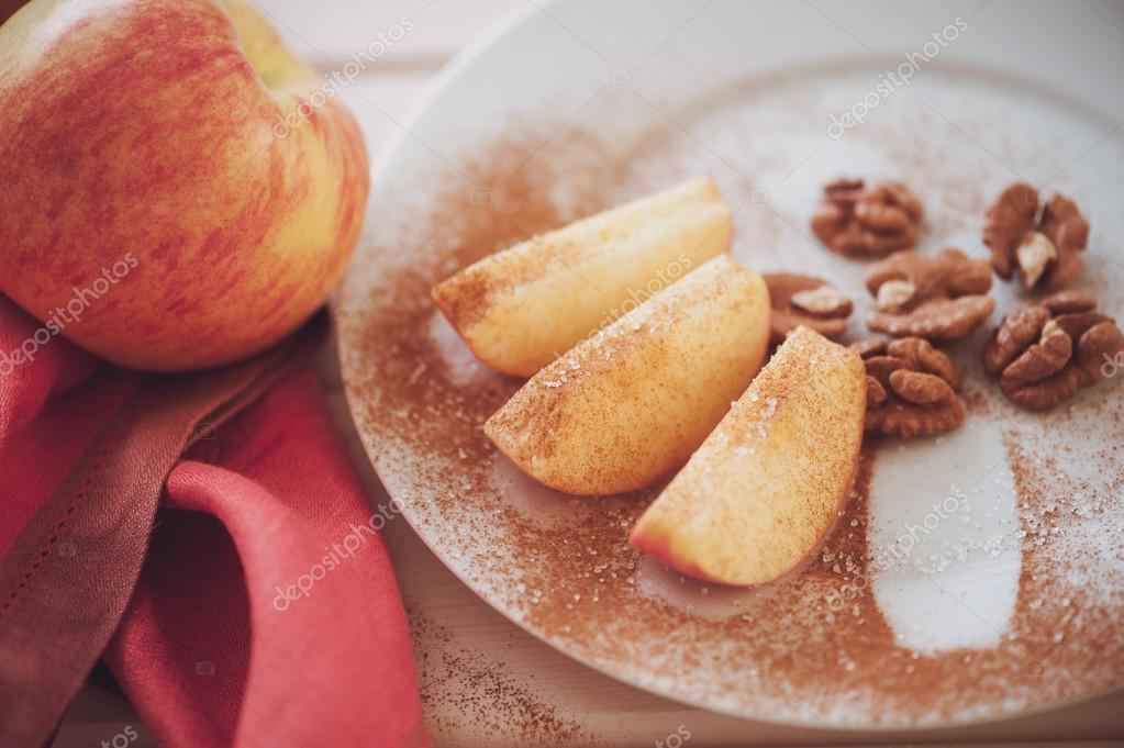 Apple is sliced into wedges with cinnamon. Stock Photo by ©massel ...