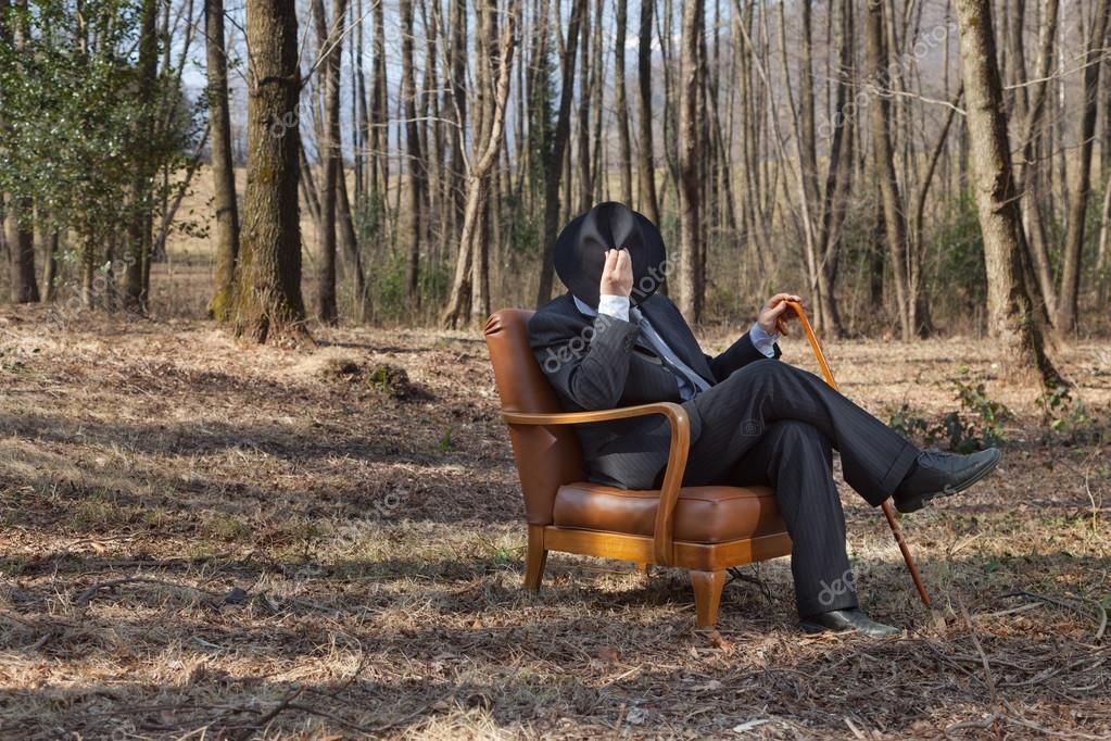 Man sitting alone in armchair — Stock Photo © Zveiger #108366818