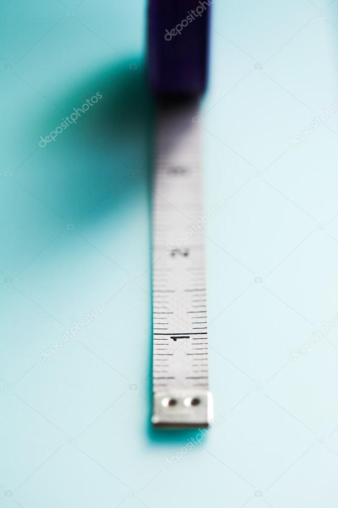 Measuring tape laying straight — Stock Photo © mjth #79455472