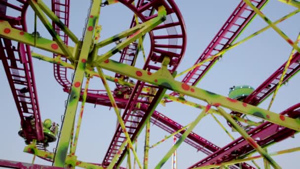 Roller coaster in motion at a theme park — Stock Video © mjth #82990154