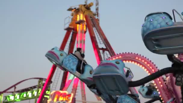 Ride in motion in theme park — Stock Video © mjth #82991790