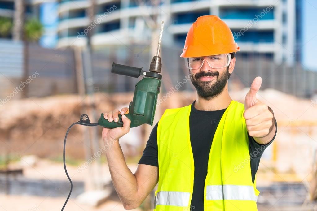 Workman with drill over white background — Stock Photo © luismolinero ...
