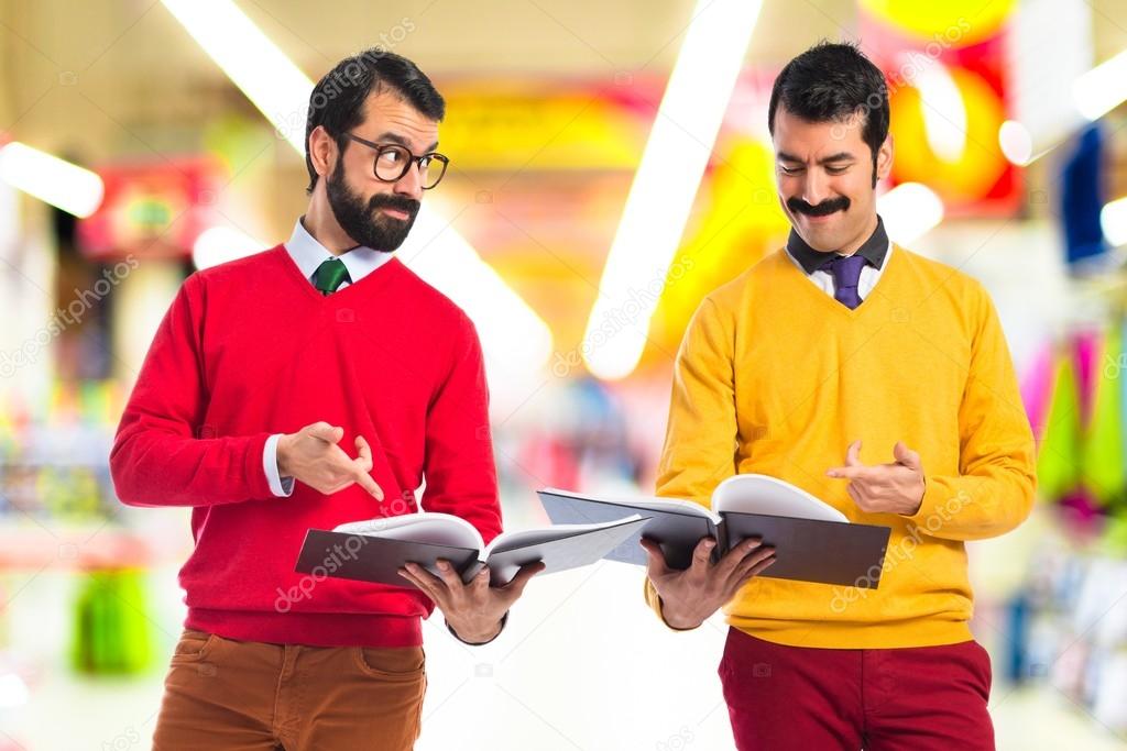 Twin brothers reading books Stock Photo by ©luismolinero 100135490