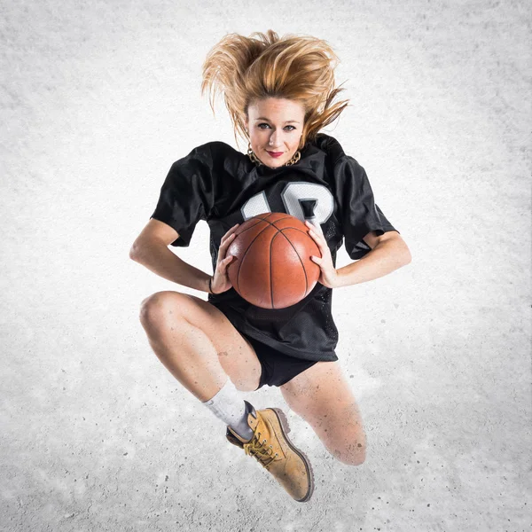 Woman jumping and playing basketball - Stock Image - Everypixel
