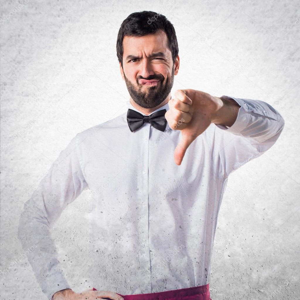 Waiter doing bad signal Stock Photo by ©luismolinero 106590032