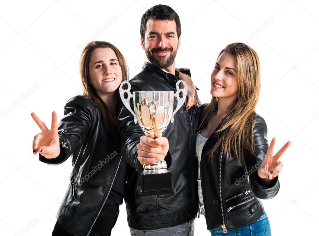 People holding a trophy Stock Photo by ©luismolinero 107219854