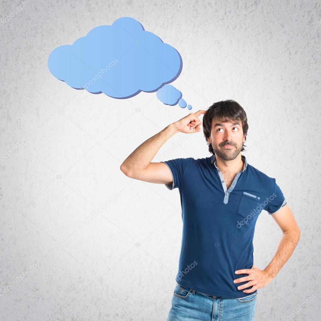 Hombre pensando sobre fondo gris: fotografía de stock © luismolinero ...