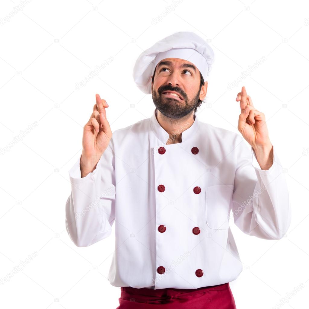 Chef with his fingers crossing over white background — Stock Photo ...