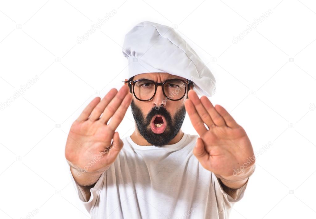 Chef making stop sign over white background — Stock Photo ...