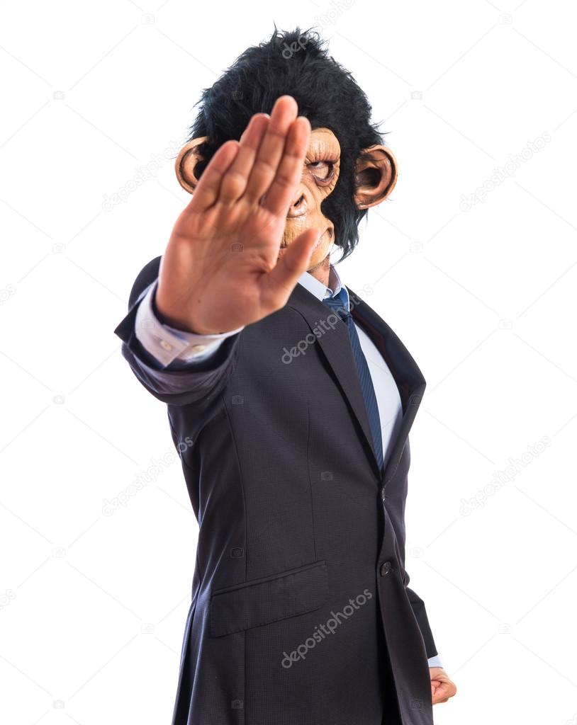 Monkey man making stop sign Stock Photo by ©luismolinero 83274092