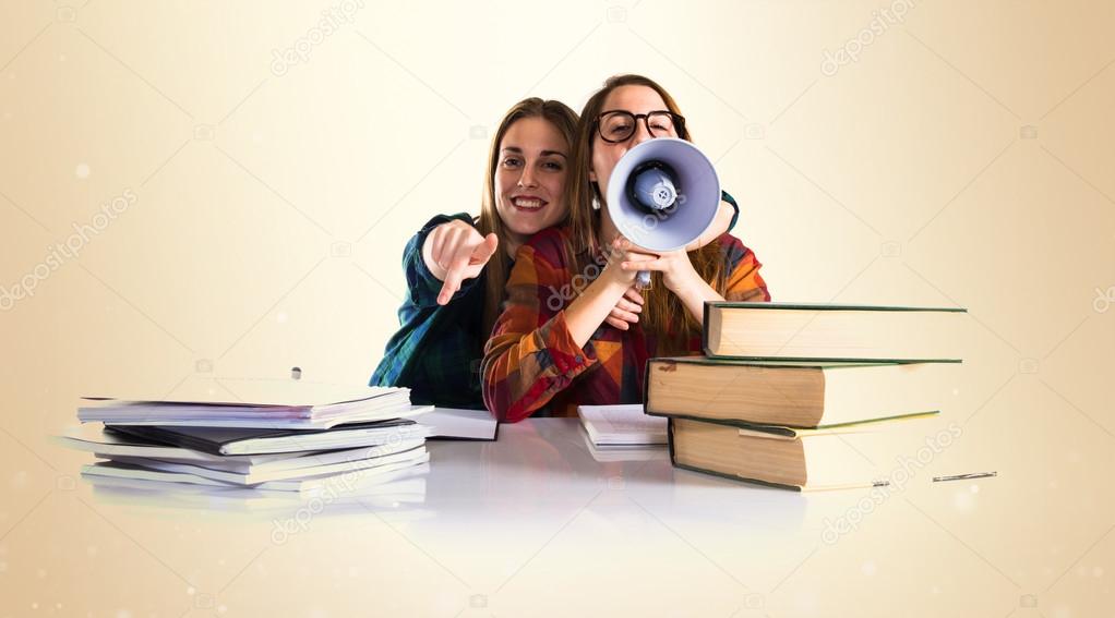 Students shouting by megaphone Stock Photo by ©luismolinero 91820428