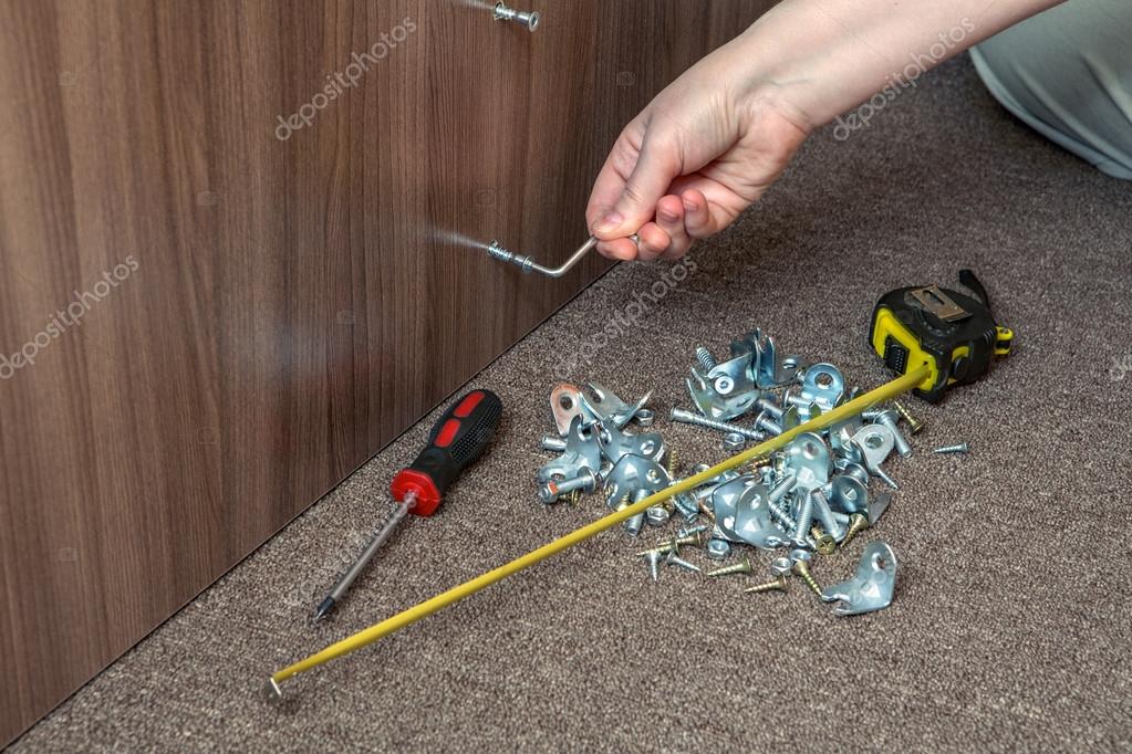Furniture assembly hand tool, hex wrench screw screwed into furniture ...