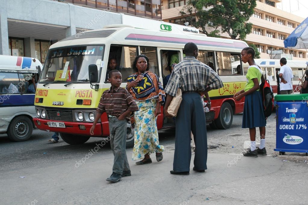 Bus stop at rush hour, passengers of municipal public transport ...