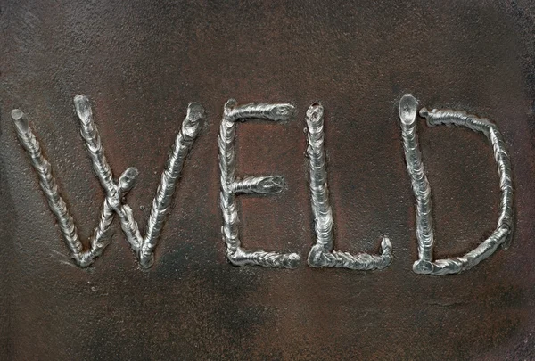 Caption welding. Weld in the form of letters Stock Photo by ...