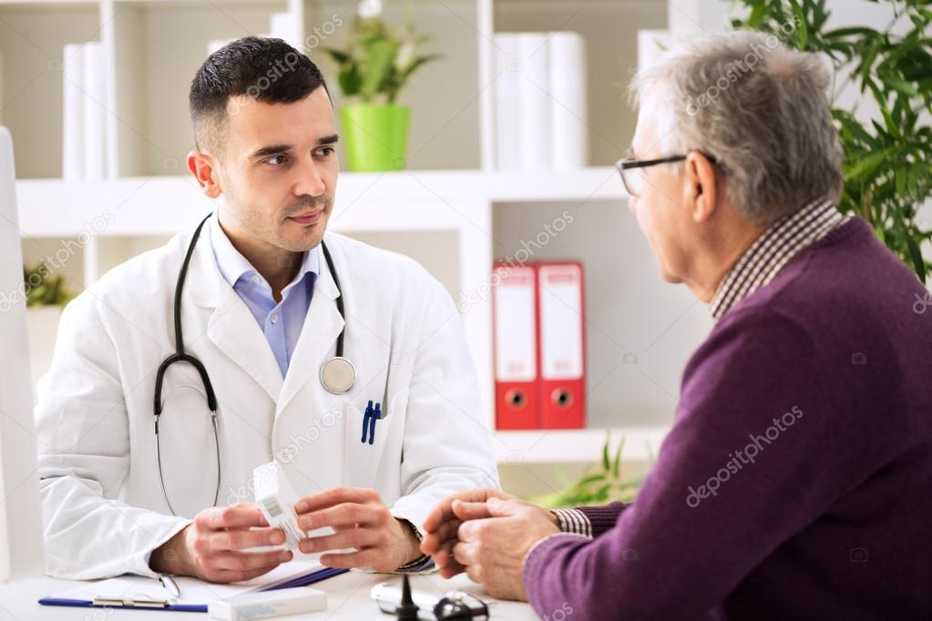 Doctor consulting patient with medicine drugs Stock Photo by ©didesign ...